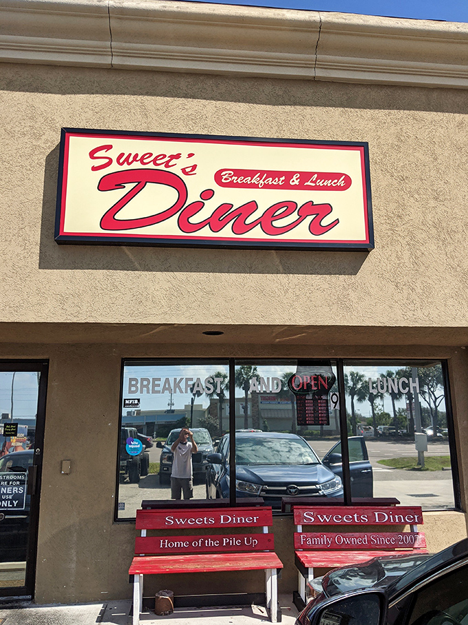 Welcome to flavor town! Sweet's Diner's retro sign promises a trip down memory lane, with a side of crispy bacon.