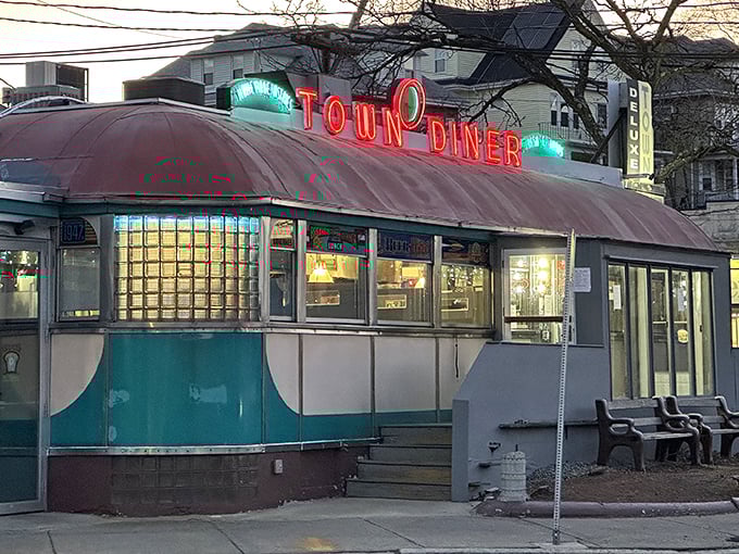 A neon-lit time machine! This classic diner exterior promises a journey back to when breakfast was king and calories were just a twinkle in your doctor's eye.