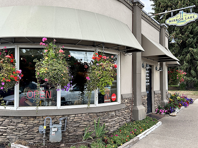 A floral welcome that's prettier than your grandma's Sunday best! Mirror Lake Diner's exterior blooms with charm, promising a feast for both eyes and stomach.