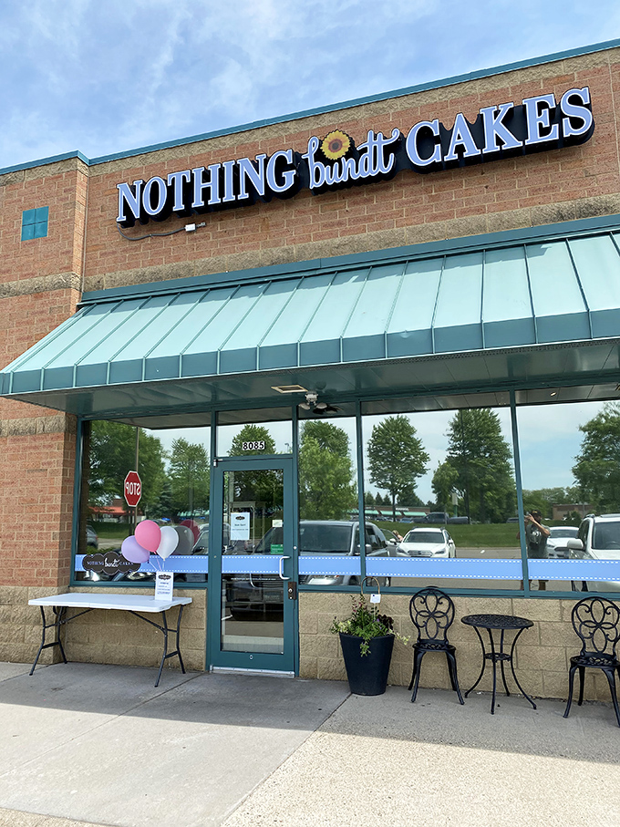 A bundt-iful sight! Nothing Bundt Cakes stands out with its cheerful teal awning, beckoning cake lovers like a sugary oasis in a strip mall desert.