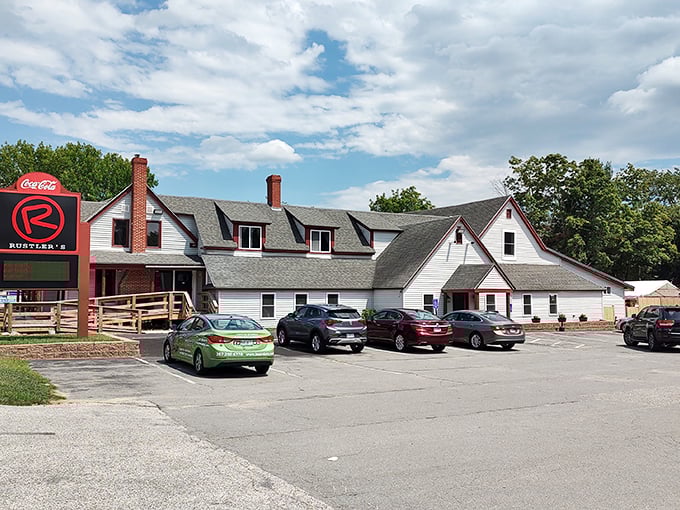 A slice of Americana with a side of sizzle! Rustler's Steak House stands proud, its white clapboard and red trim beckoning hungry travelers like a lighthouse for the famished.