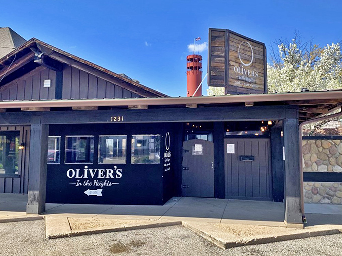 Welcome to pizza paradise! Oliver's sleek exterior is like a little black dress for buildings &ndash; classy, timeless, and always inviting.