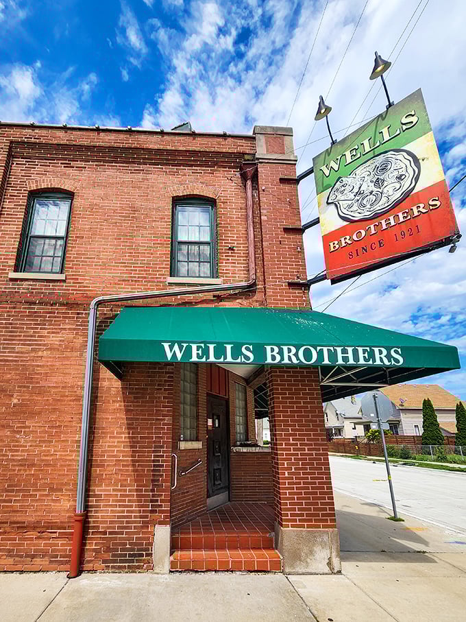A slice of history served with a side of neon! Wells Brothers' iconic sign has been guiding pizza pilgrims since 1921, proving some things really do get better with age.