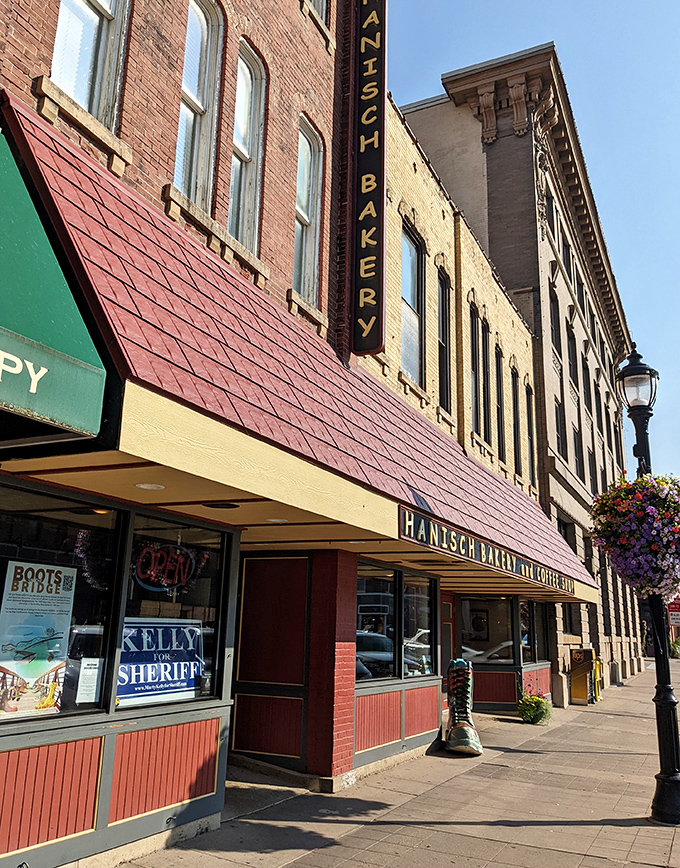 A slice of small-town charm! Hanisch Bakery's brick facade and vintage signage promise sweet treasures within, like a time capsule of deliciousness.