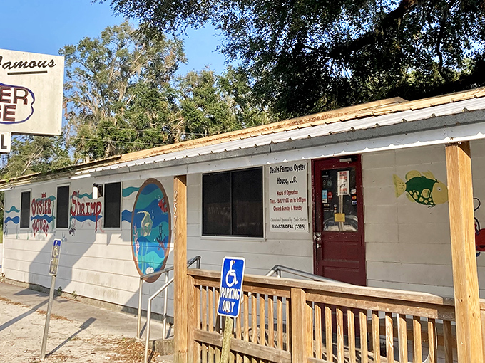 Welcome to seafood paradise! Deal's Famous Oyster House stands proud, its weathered sign a beacon for bivalve enthusiasts and hungry travelers alike.