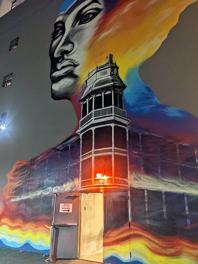 A splash of color in the concrete jungle! This mural hints at the hidden wonders waiting just around the corner.