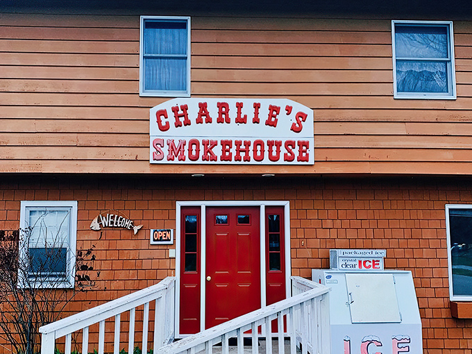 Welcome to flavor town! Charlie's Smokehouse stands proud, its red door beckoning like a lighthouse for ice cream lovers. Who knew paradise had a zip code?