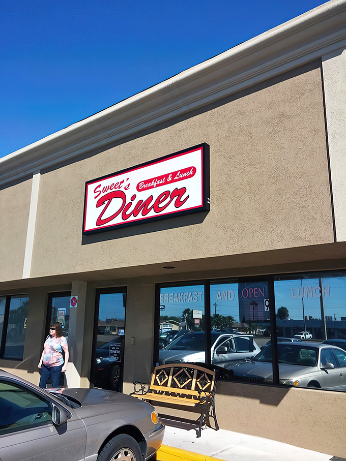 Welcome to flavor town! Sweet's Diner's retro sign promises a trip down memory lane, with a side of crispy bacon.