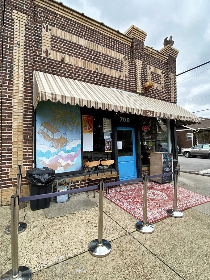 A brick facade with a whimsical mural? Sky Blue Cafe's exterior is like a warm hug for your eyeballs!