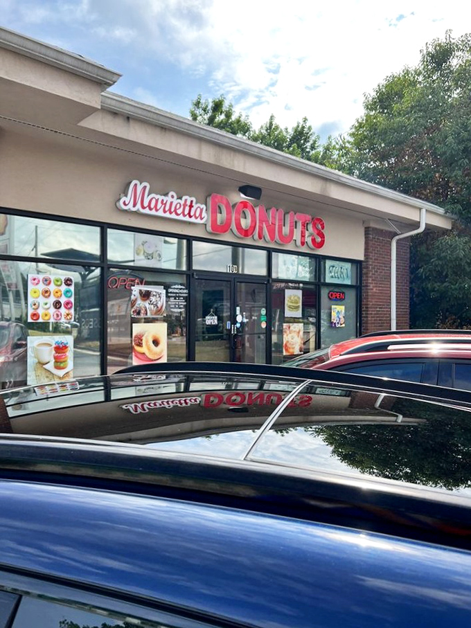 Welcome to donut paradise! Marietta Donuts' storefront promises a sugar-coated adventure that'll make your taste buds do a happy dance.