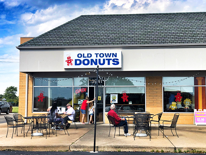 Welcome to donut paradise! Old Town Donuts beckons with its cheery red sign, promising sweet delights and a slice of small-town charm.