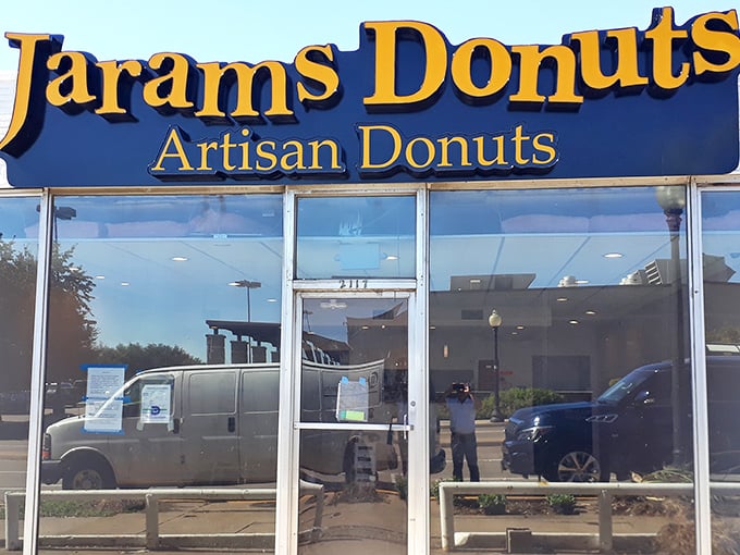 A purple-trimmed beacon of sugary salvation! Jarams Donuts stands out like a confectionery oasis, promising sweet relief from the ordinary.