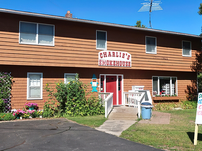 Welcome to flavor town! Charlie's Smokehouse stands proud, its red door beckoning like a lighthouse for seafood lovers. Who knew paradise had a zip code?