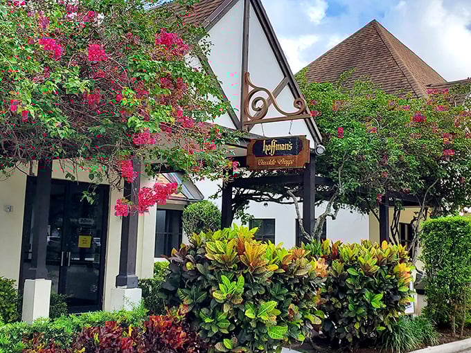 A chocolate lover's dream come true! Hoffman's Tudor-style facade promises sweet adventures within, framed by vibrant bougainvillea.