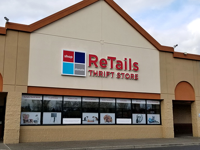 ReTails Thrift Store's welcoming storefront features adorable pet photos, setting the tone for a shopping adventure that helps our four-legged friends.