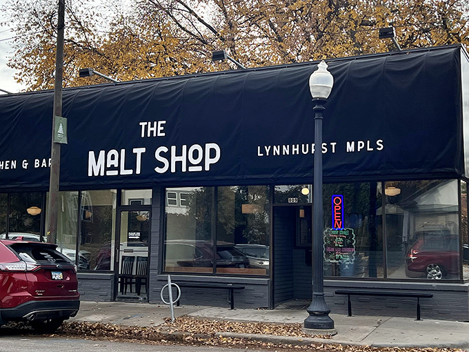 Welcome to flavor town! The Malt Shop's navy awning beckons like a siren song, promising sweet salvation for your taste buds.