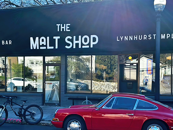 Welcome to flavor town! The Malt Shop's navy awning beckons like a siren song, promising sweet salvation for your taste buds.