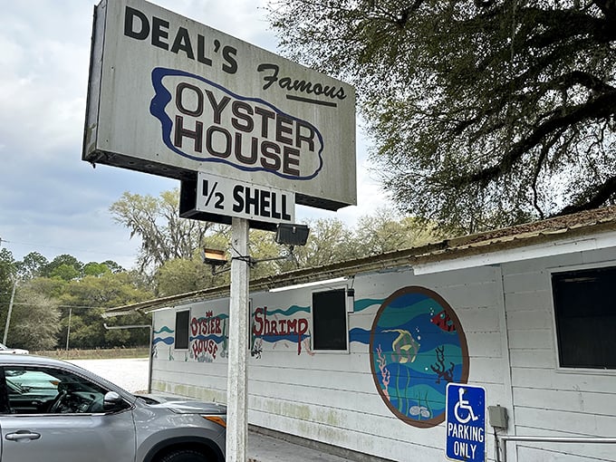 Welcome to seafood paradise! Deal's Famous Oyster House stands proud, its weathered sign a beacon for bivalve enthusiasts and hungry travelers alike.