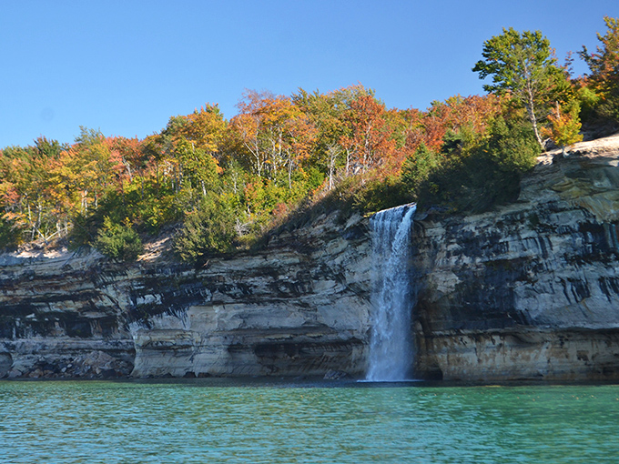 Nature's own IMAX: Spray Falls cascades down colorful sandstone cliffs, creating a spectacle that puts Hollywood special effects to shame.