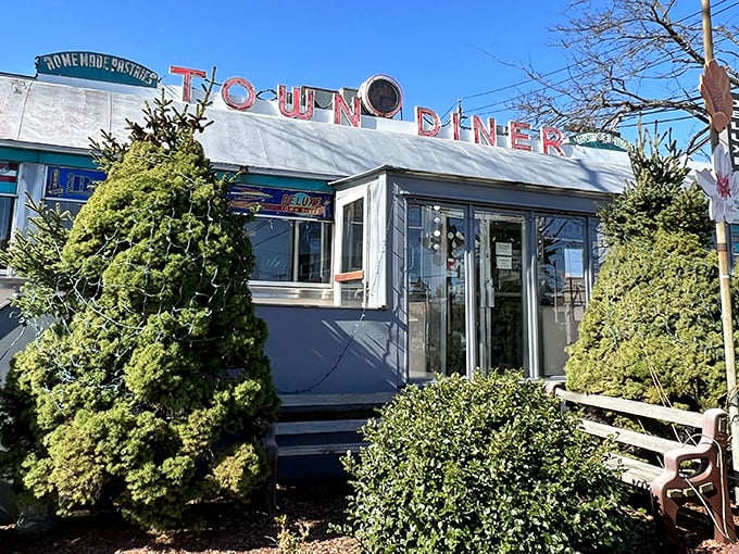 A neon-lit time machine! This classic diner exterior promises a journey back to when breakfast was king and calories were just a twinkle in your doctor's eye.