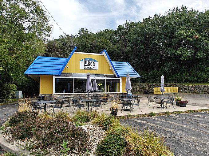 Welcome to breakfast paradise! Luke's Cafe's cheery exterior is like a ray of sunshine, promising delicious adventures within. Who needs a pot of gold when you've got a blue-roofed diner?
