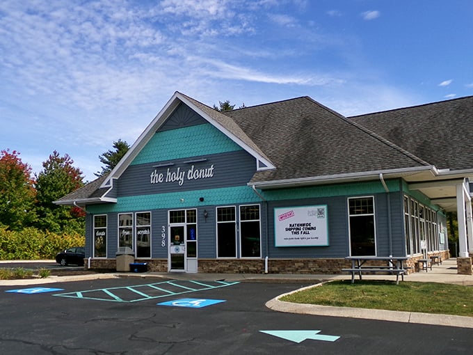 Holy moly, donut lovers! This teal-and-gray haven is where carb dreams come true. The Holy Donut's charming exterior promises a heavenly experience inside.
