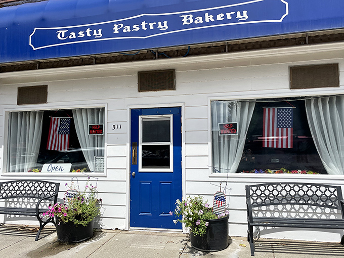 A slice of small-town heaven! Tasty Pastry Bakery's charming storefront beckons with the promise of sugary delights and a warm welcome.