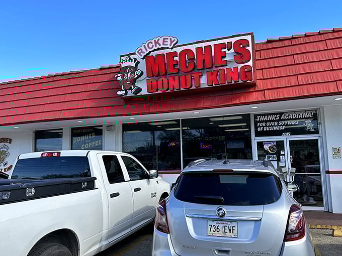 Welcome to donut paradise! Rickey Meche's Donut King stands proud, its red roof a beacon of sugary salvation for Lafayette's sweet-toothed masses.