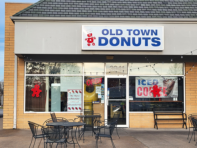 Welcome to donut paradise! Old Town Donuts beckons with its cheery red sign, promising sweet delights and a slice of small-town charm.