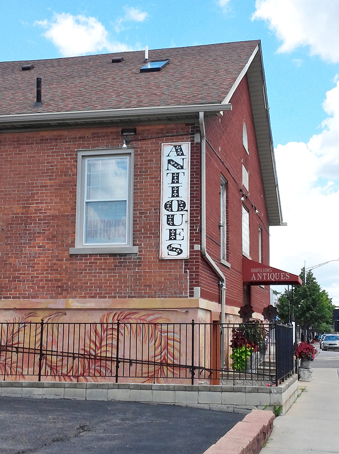 A brick-and-mortar time machine! Odd Fellows Antiques stands proud, its vintage sign beckoning curious souls to step into a world where every object tells a story.