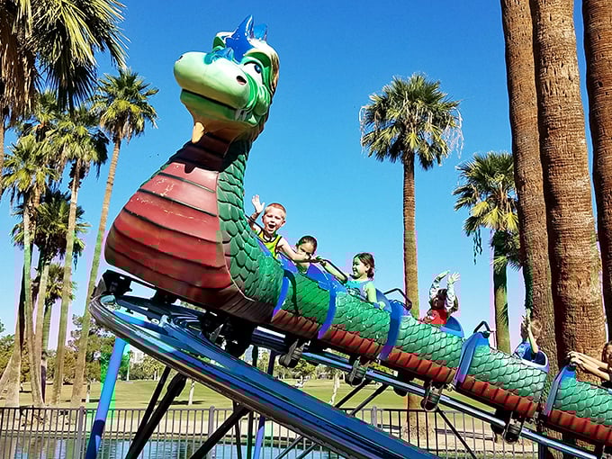 All aboard the whimsy express! This dragon-themed roller coaster proves that even reptiles can be cuddly when they're giving you the ride of your life.