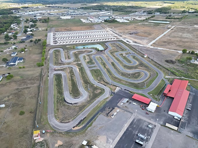 Buckle up, speed demons! This aerial view of Dallas Karting Complex is like a racetrack buffet &ndash; all you can eat turns, with a side of adrenaline.