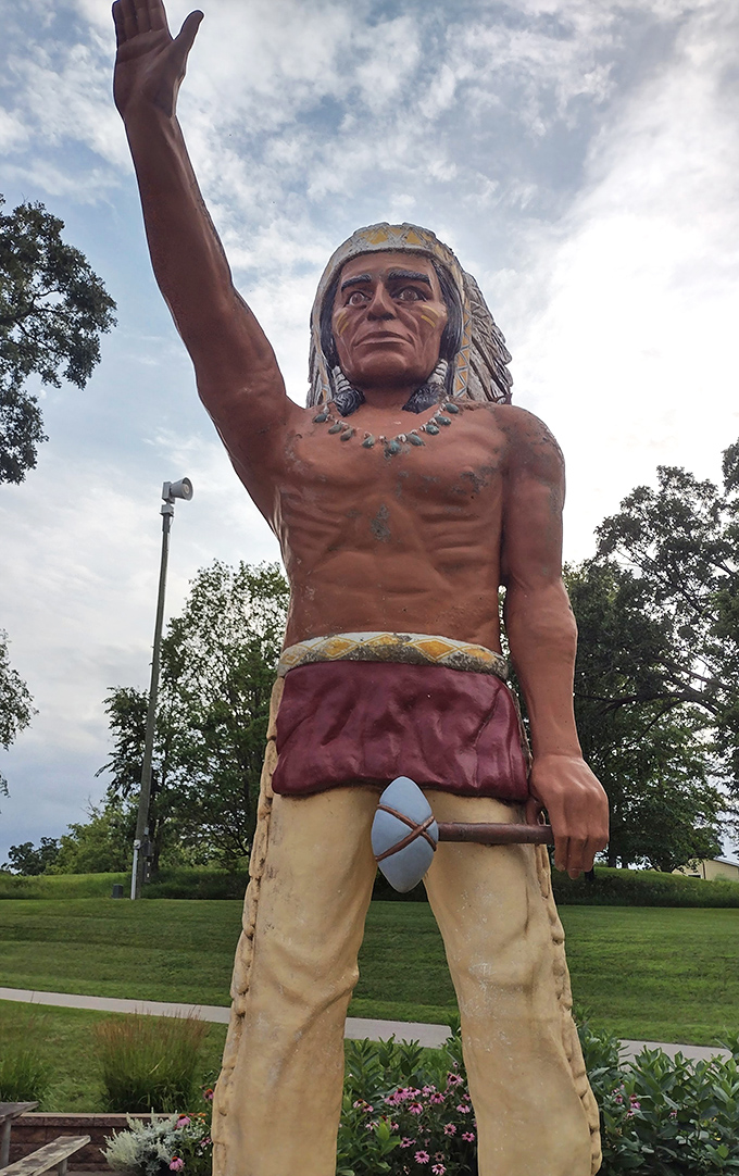 Reaching for the sky or hailing a cosmic taxi? Chief Wenonga's statue stands tall, greeting visitors with an enthusiasm that rivals a Minnesotan welcoming spring.