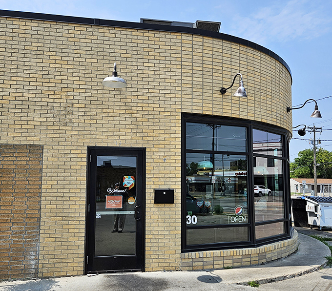 Brew Bird's curved brick exterior isn't just a wall&mdash;it's a warm hug welcoming you to flavor town. This unassuming facade hides a world of culinary delights waiting to be discovered.