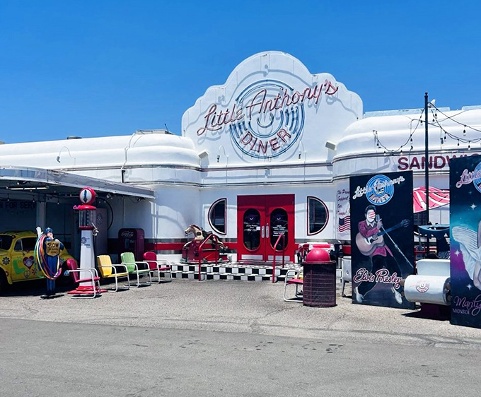 Step into a time warp! Little Anthony's Diner's exterior is a gleaming beacon of 1950s nostalgia, complete with classic cars and Elvis-inspired decor.
