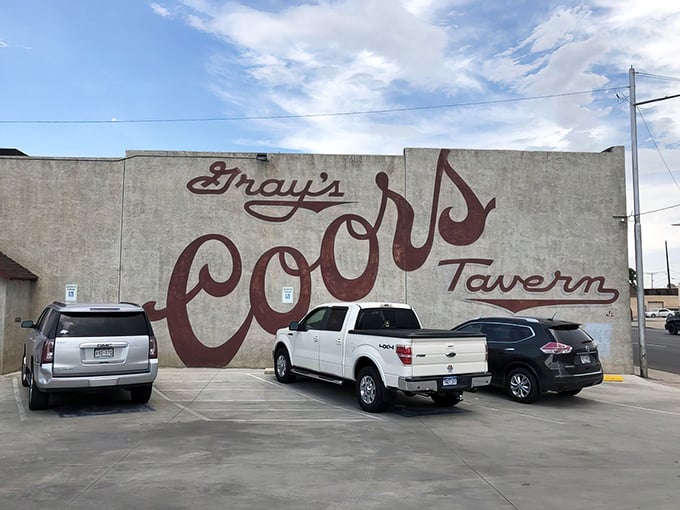 Welcome to flavor town! Gray's Coors Tavern's exterior promises a journey through time and taste, with its vintage charm and inviting beer garden.