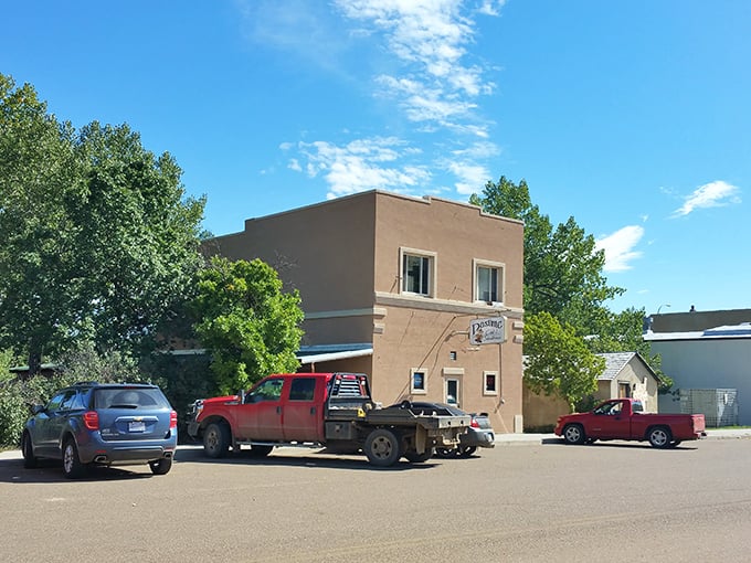 Welcome to flavor town! The Pastime Club & Steakhouse's unassuming exterior hides a world of culinary delights, proving you should never judge a book by its cover – or a steakhouse by its siding.