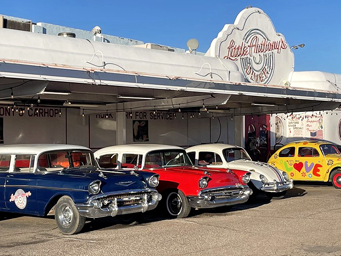 Step into a time warp! Little Anthony's Diner's exterior is a gleaming beacon of 1950s nostalgia, complete with classic cars and Elvis-inspired decor.