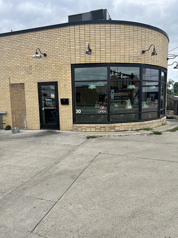 Brew Bird's curved brick exterior isn't just a wall&mdash;it's a warm hug welcoming you to flavor town. This unassuming facade hides a world of culinary delights waiting to be discovered.