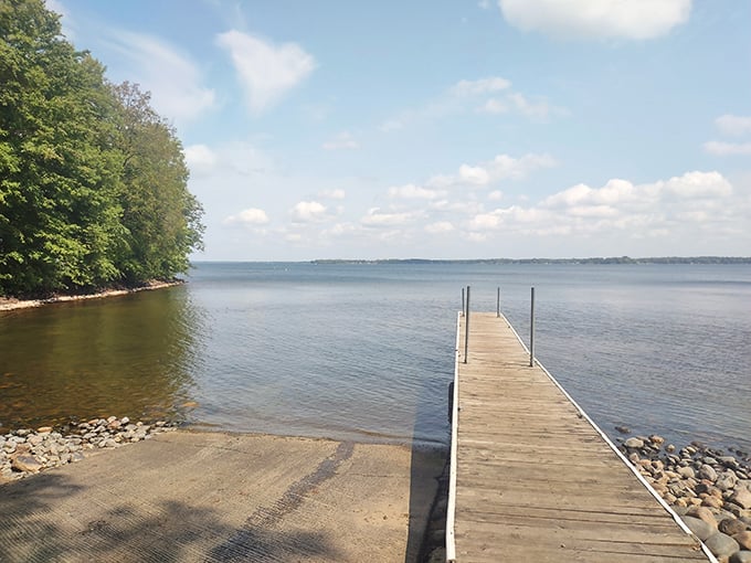 Gateway to tranquility! This wooden pier stretches into Mille Lacs Lake like a runway for daydreams, inviting you to leave your worries on the shore.