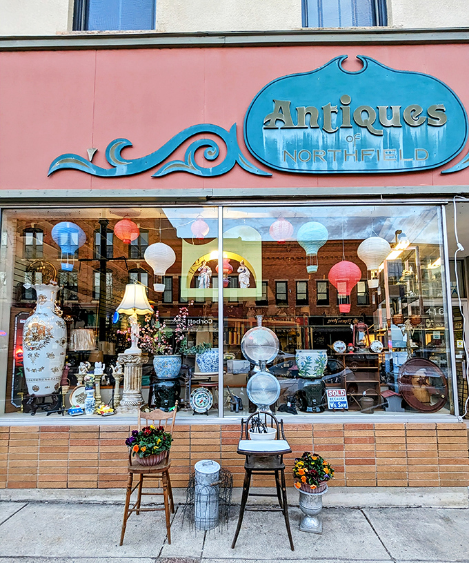 Step into a time machine disguised as a storefront! Antiques of Northfield's whimsical window display is like your grandma's attic, but curated by a magical decorator.