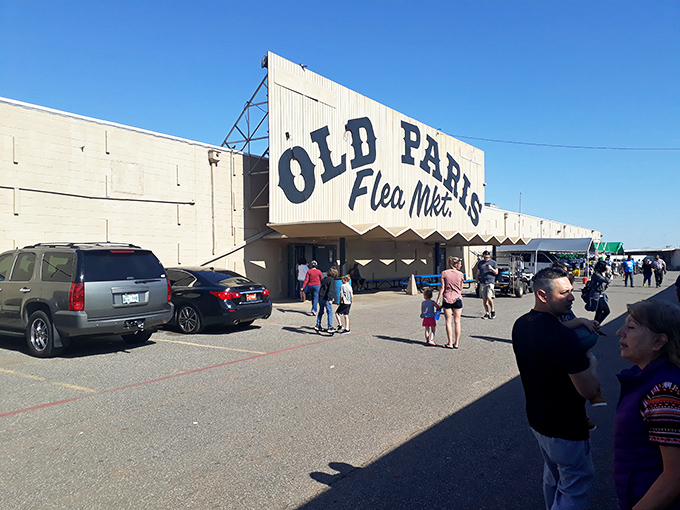 Welcome to the treasure hunter's paradise! Old Paris Flea Market beckons with its retro sign, promising a labyrinth of curiosities and bargains inside.