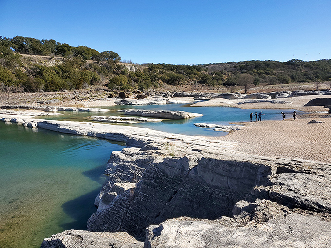 Nature's infinity pool! This turquoise oasis nestled among limestone cliffs is Mother Earth's answer to the resort experience.