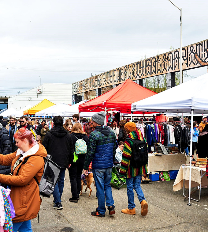 Welcome to Portland Flea, where vintage dreams come true! Colorful tents and eclectic crowds create a treasure hunter's paradise under the iconic Portland sky.