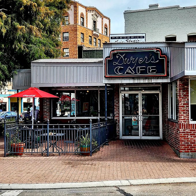 A neon sign that could guide hungry sailors home! Dwyer's Cafe stands proud, a brick-and-mortar beacon of breakfast bliss in downtown Lafayette.