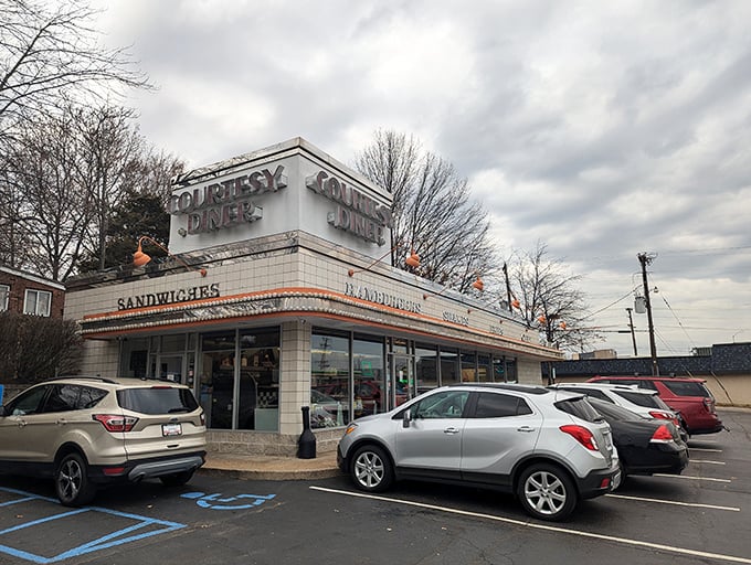 Neon dreams come true! Courtesy Diner's retro sign beckons like a lighthouse for the hungry, promising comfort food and a slice of Americana.