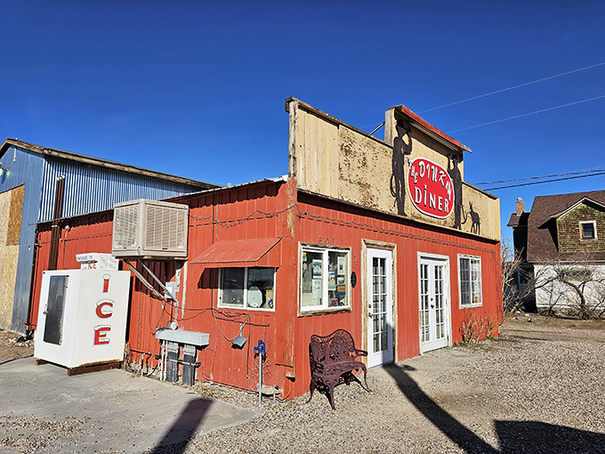 Welcome to the Dinky Diner, where big flavors come in small packages! This charming red exterior is like a beacon of comfort food in the Nevada desert. 