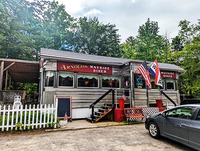 A time capsule on wheels! Arnold's Wayside Diner sits pretty amidst autumn foliage, promising a feast for both eyes and stomach.
