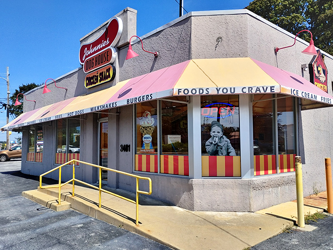 Welcome to flavor town! Johnnie's Dog House and Chicken Shack beckons with its cheerful awning and promise of comfort food that'll make your taste buds do a happy dance.
