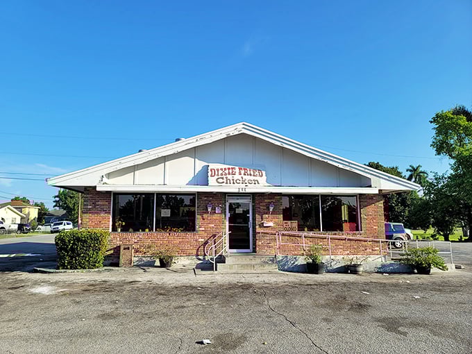 Welcome to chicken paradise! Dixie Fried Chicken's unassuming exterior hides a world of crispy, juicy delights. It's like finding the Holy Grail of comfort food in Belle Glade.